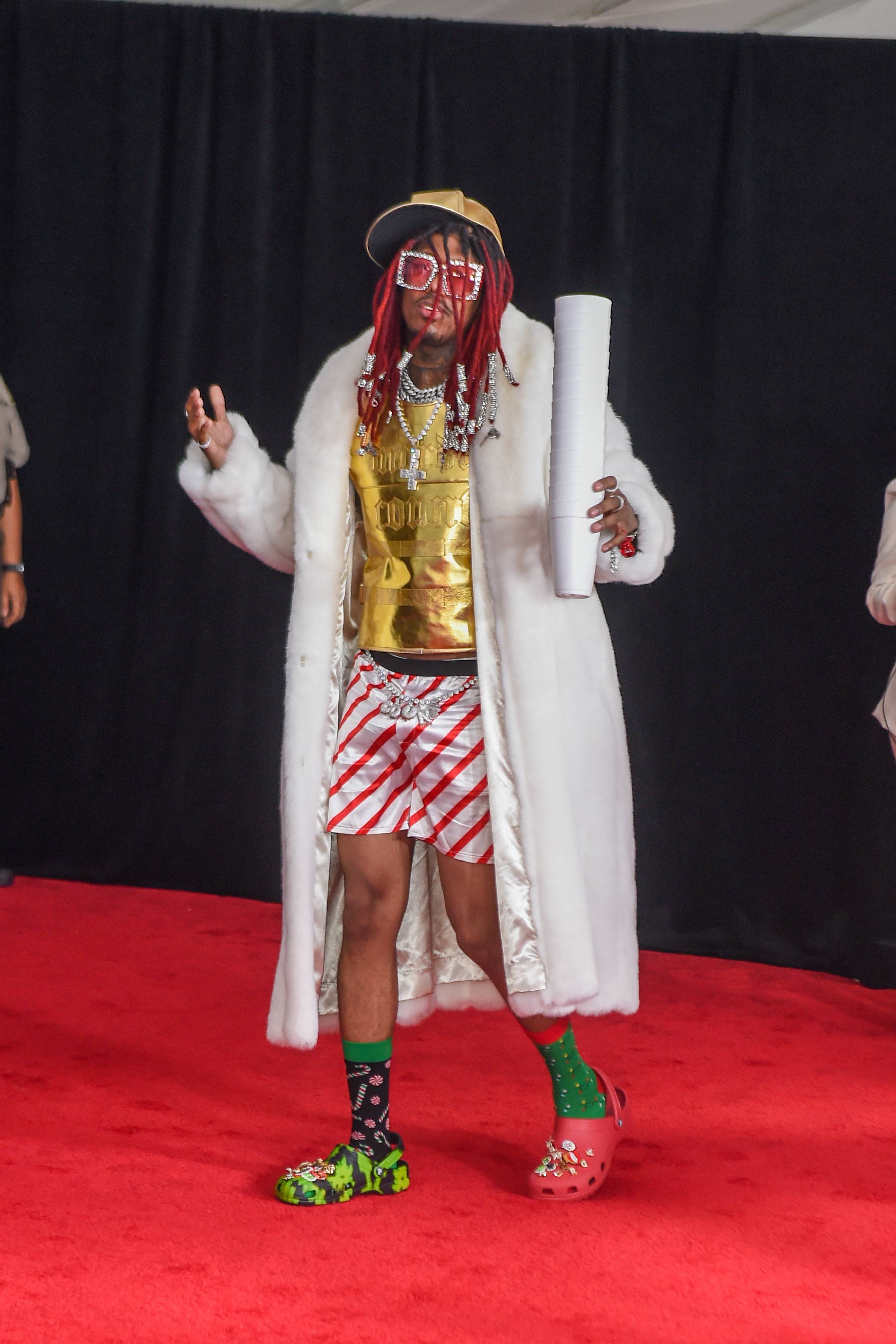 Nick Cannon Sports Mismatched Crocs, White Fur On Red Carpet At Hip Hop ...
