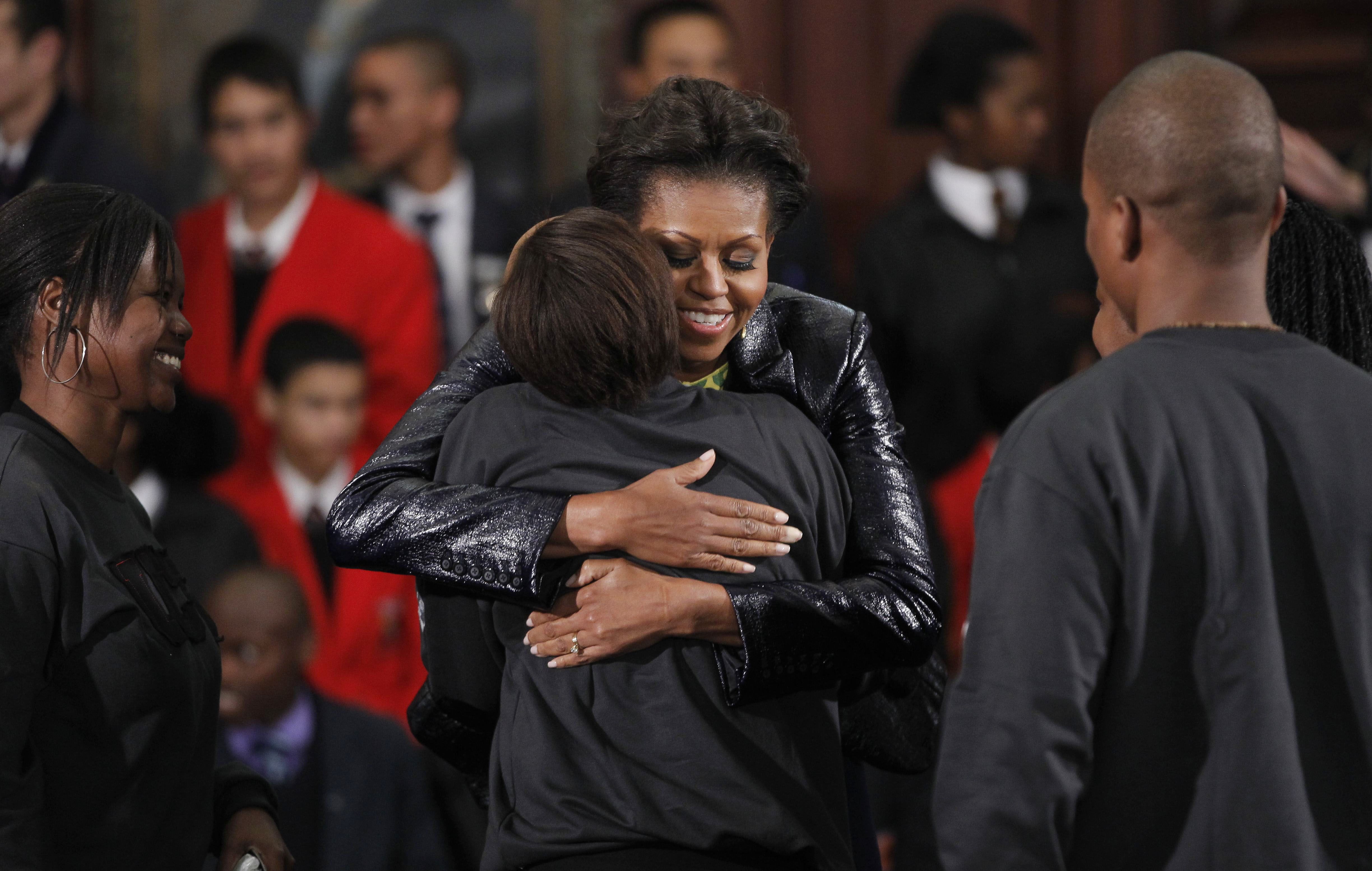 Hugs! - Obama hugs - Image 16 from Photos: Michelle Obama in South ...